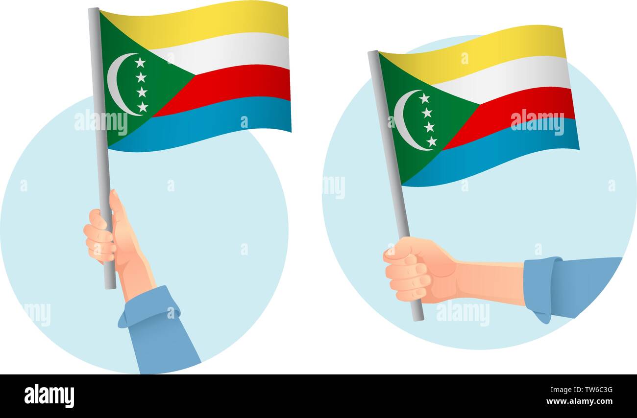 Comoros flag in hand. Patriotic background. National flag of Comoros ...