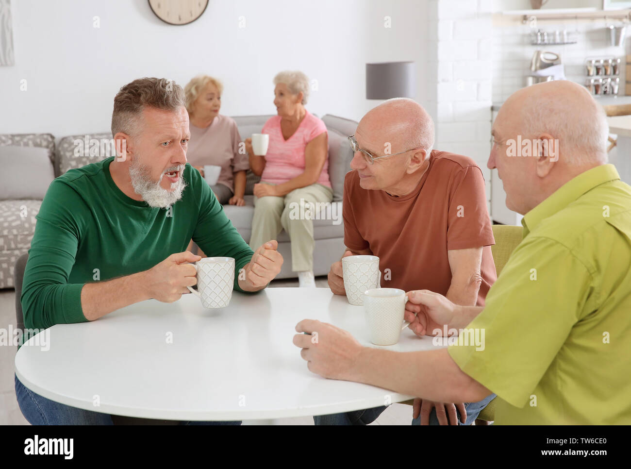 Group of elderly people resting at home Stock Photo - Alamy