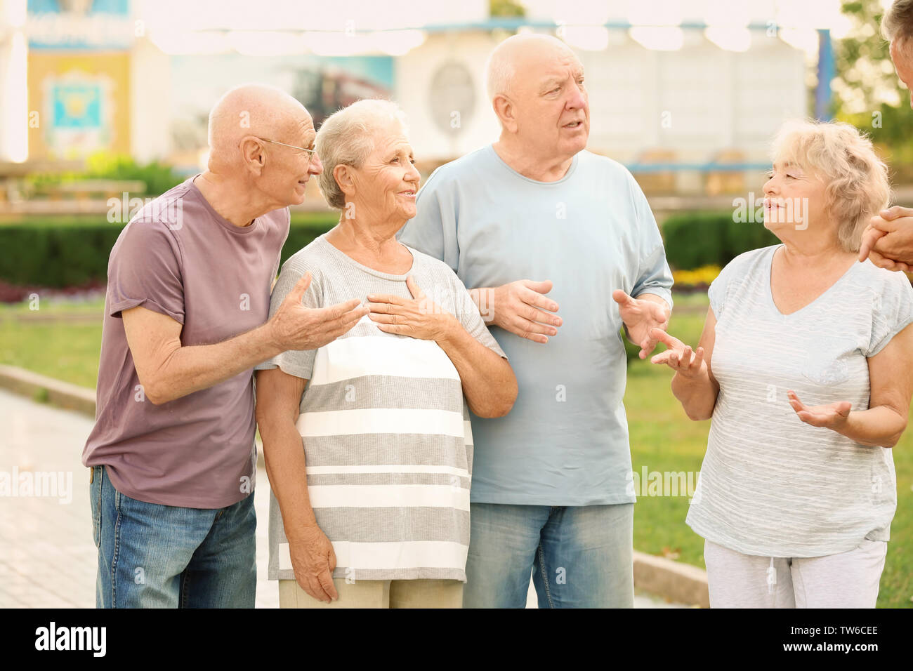 Group of elderly people resting in park Stock Photo - Alamy