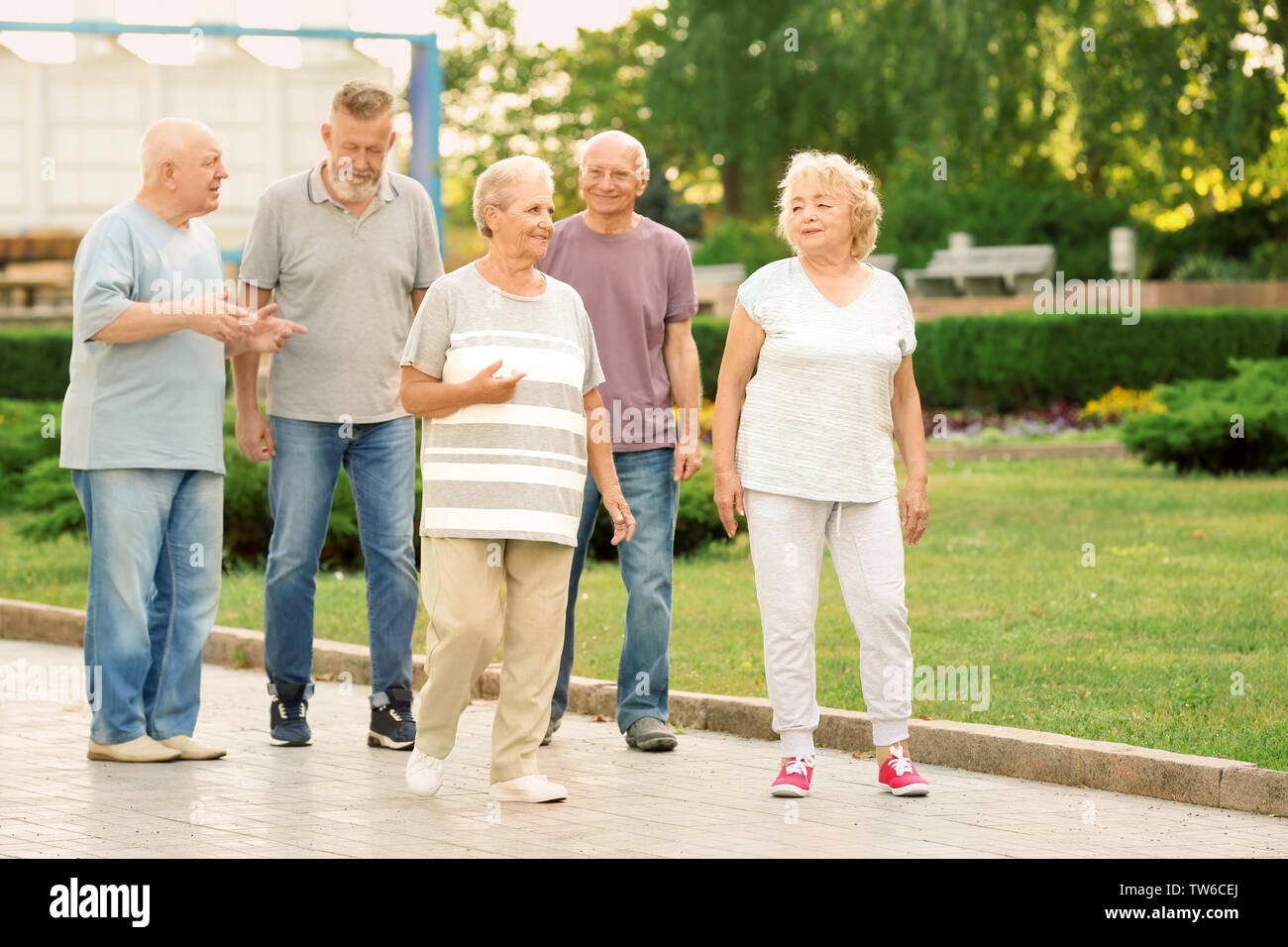 Group of elderly people resting in park Stock Photo - Alamy