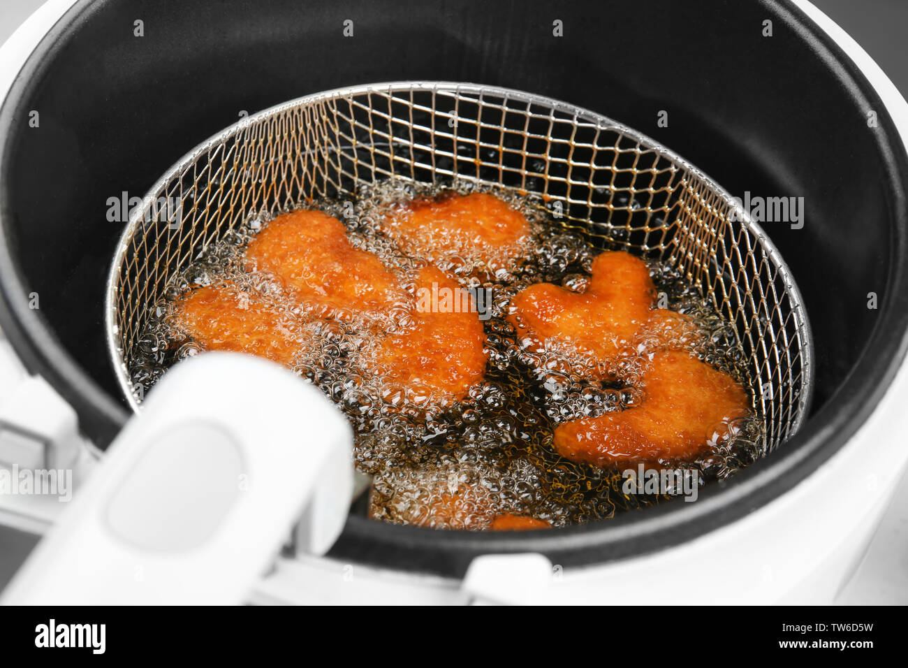 Chicken nuggets frying in hot hi-res stock photography and images - Alamy