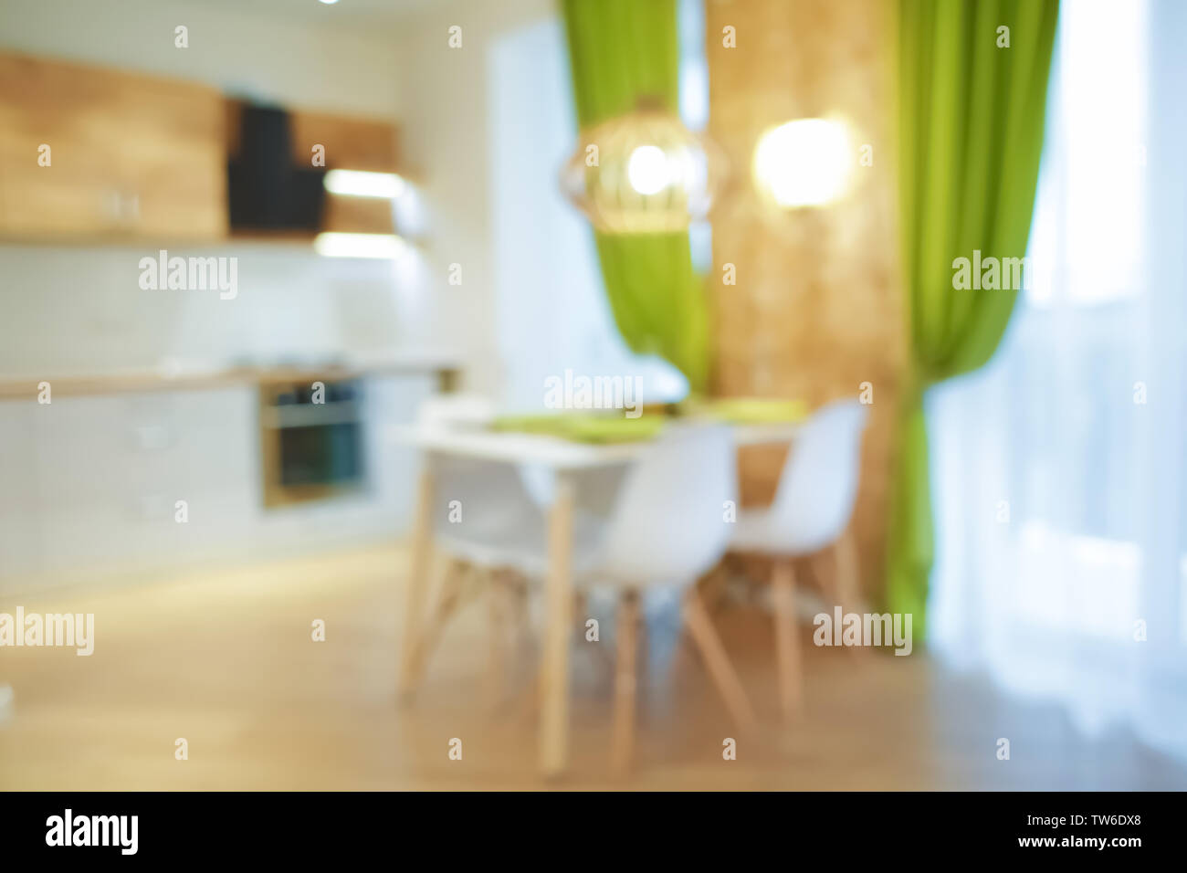 Interior of light modern kitchen, blurred view Stock Photo - Alamy