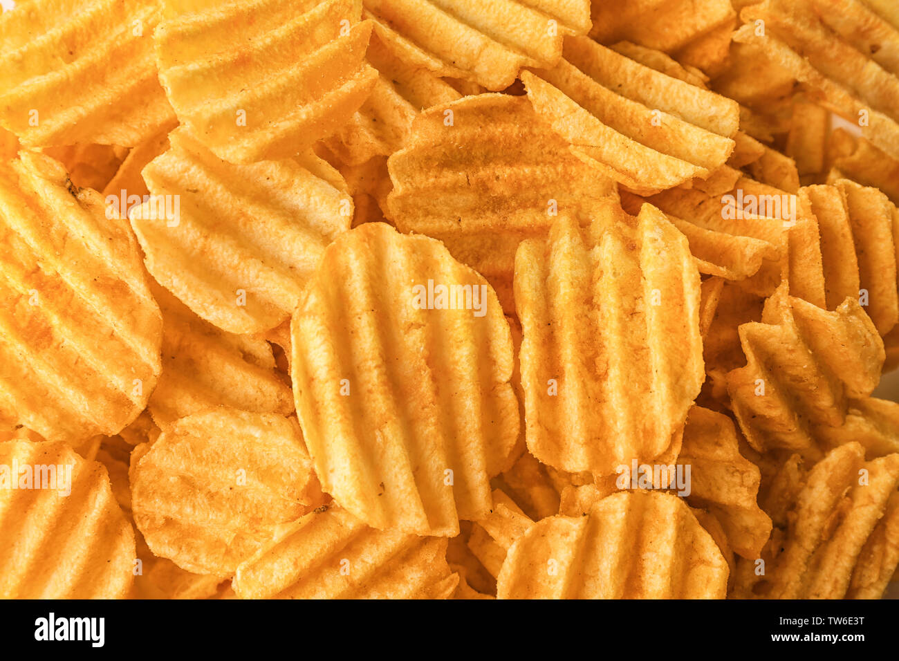 Potato chips as background Stock Photo - Alamy