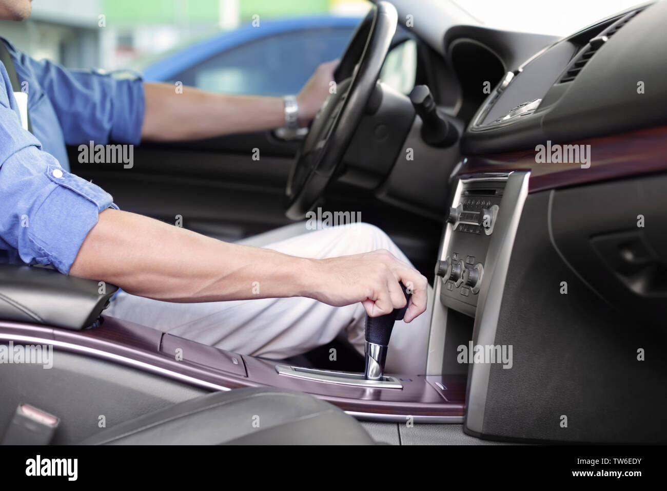 Driver's hand on gear lever Stock Photo - Alamy