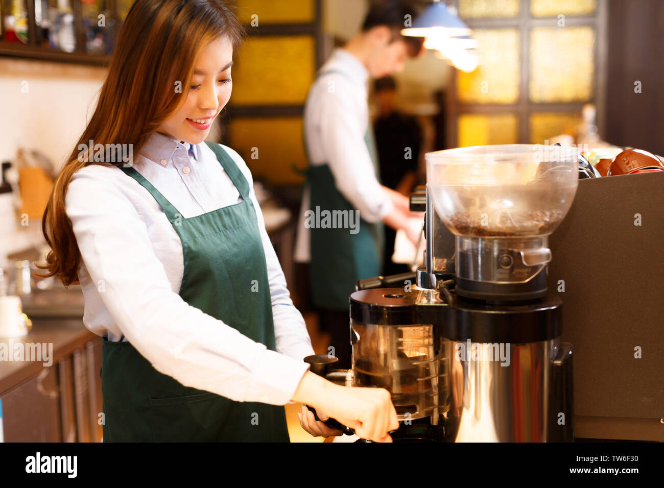 Make it waitress and waiter in cafe Stock Photo - Alamy