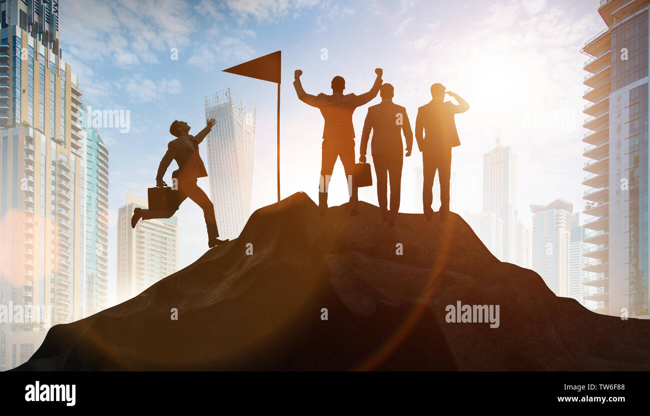 Businessmen in achievement and teamwork concept Stock Photo - Alamy