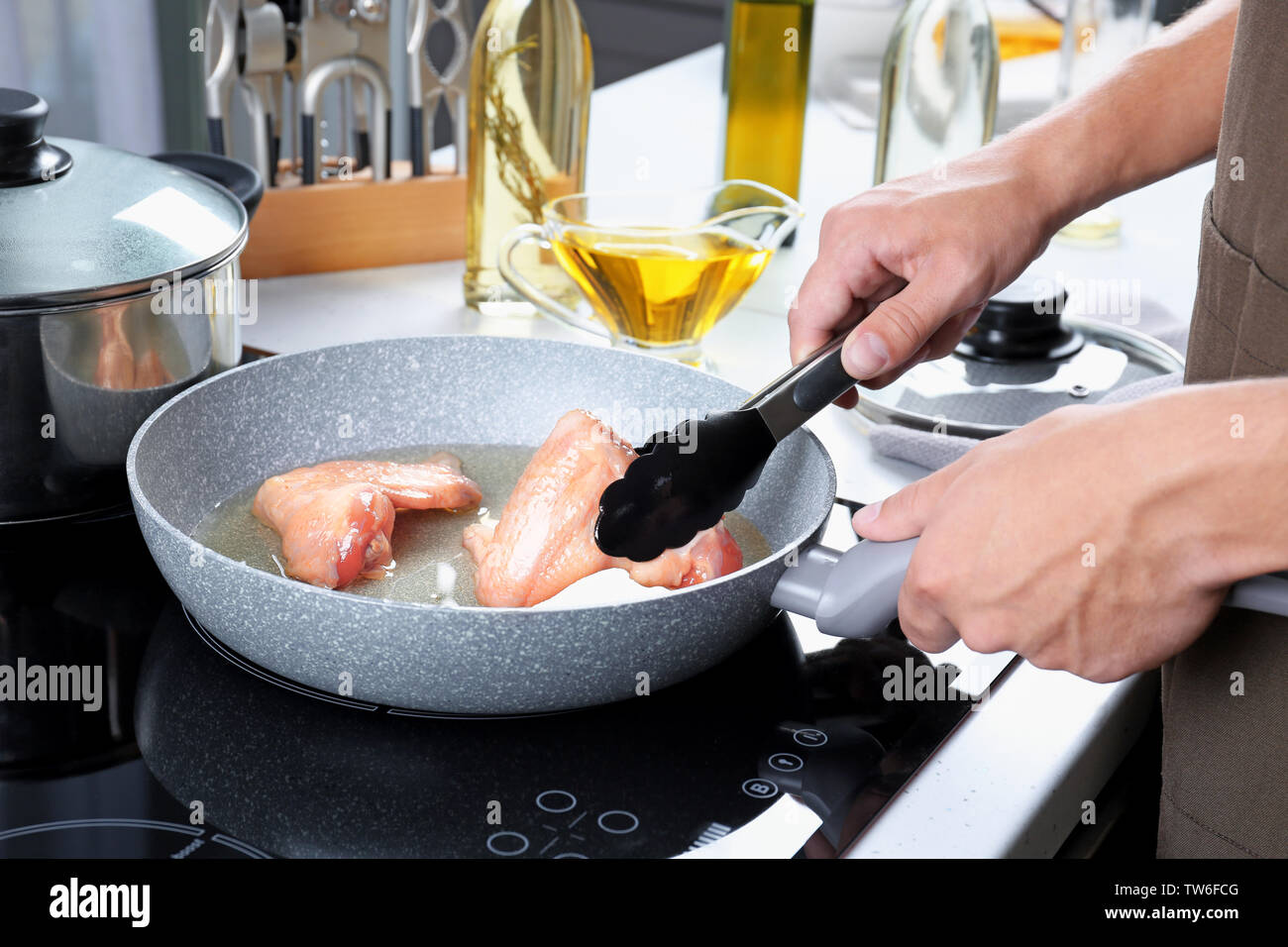 Man eating chicken wings hi-res stock photography and images - Alamy