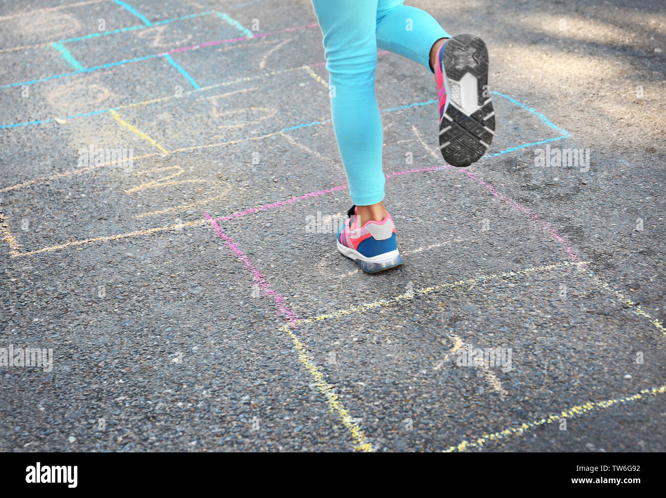 Child playing hopscotch outdoors Stock Photo - Alamy