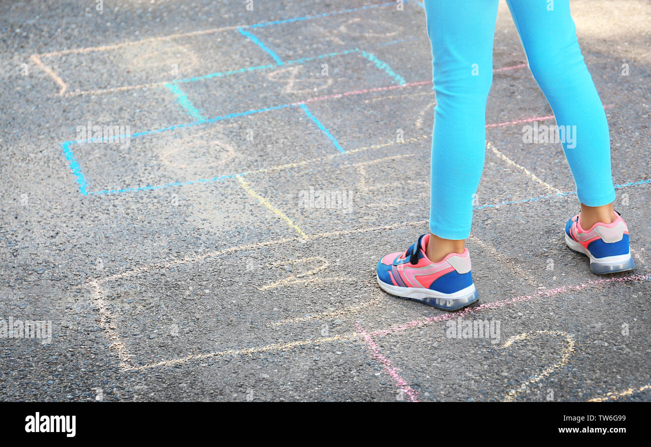 Child playing hopscotch outdoors Stock Photo - Alamy