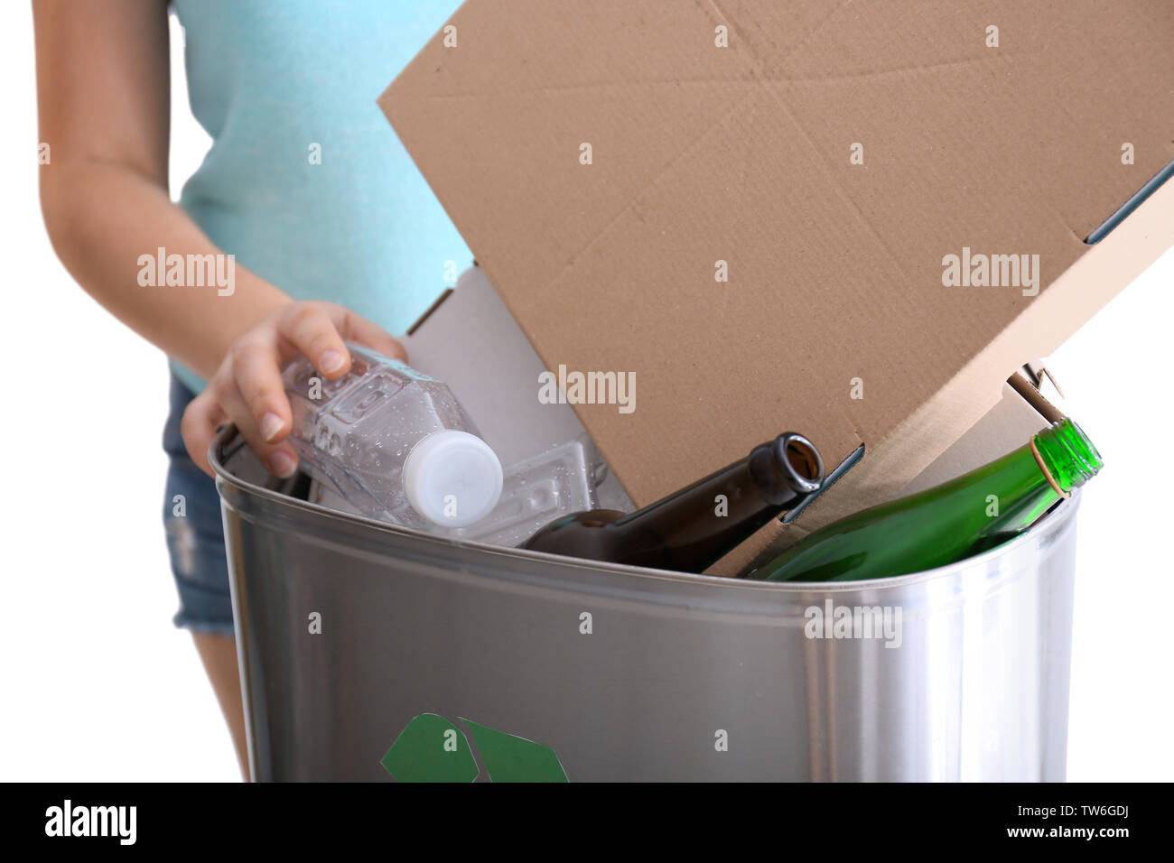 Young woman throwing garbage into litter bin on white background Stock ...