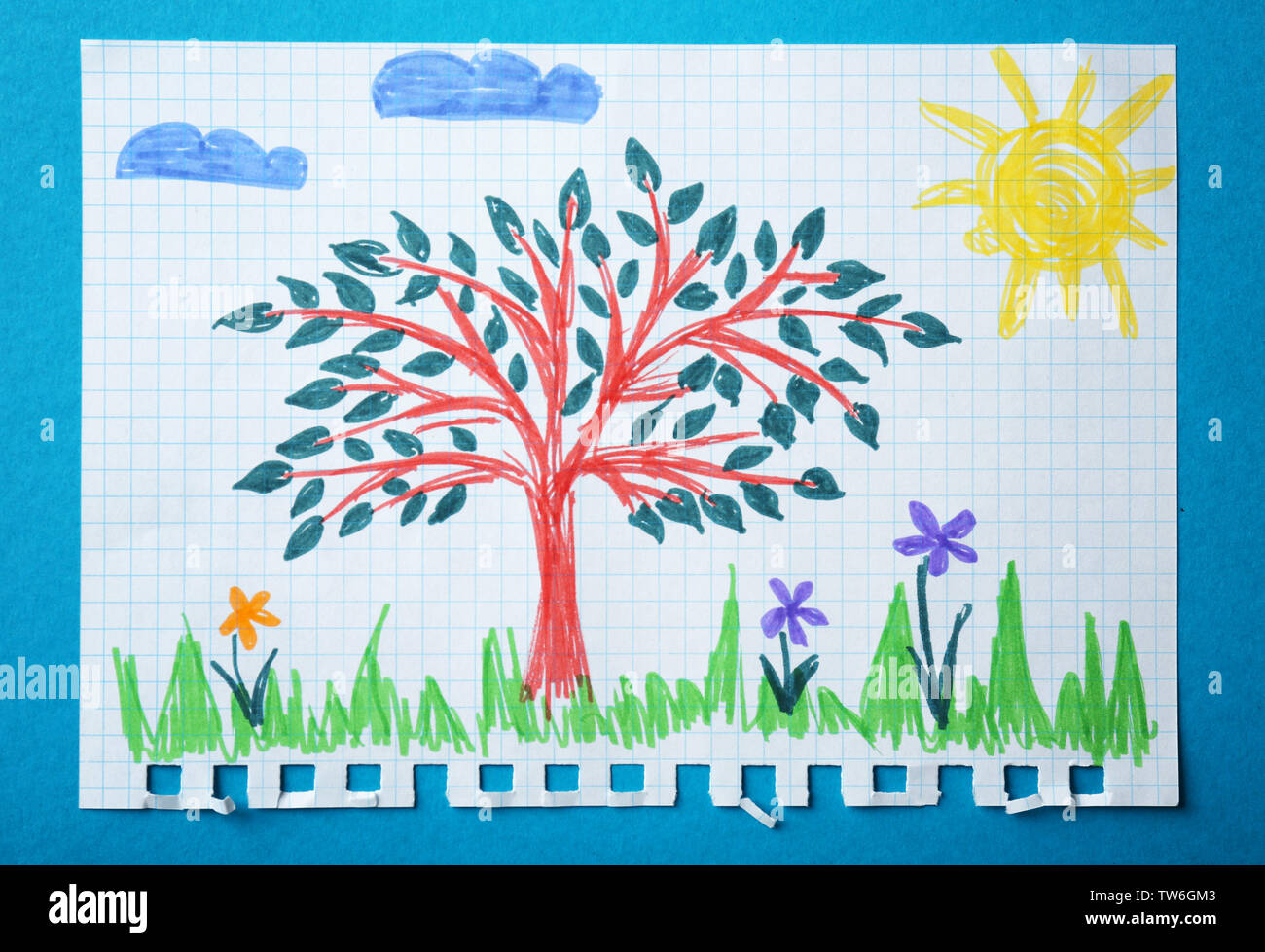 Child's drawing of tree on blue background Stock Photo - Alamy