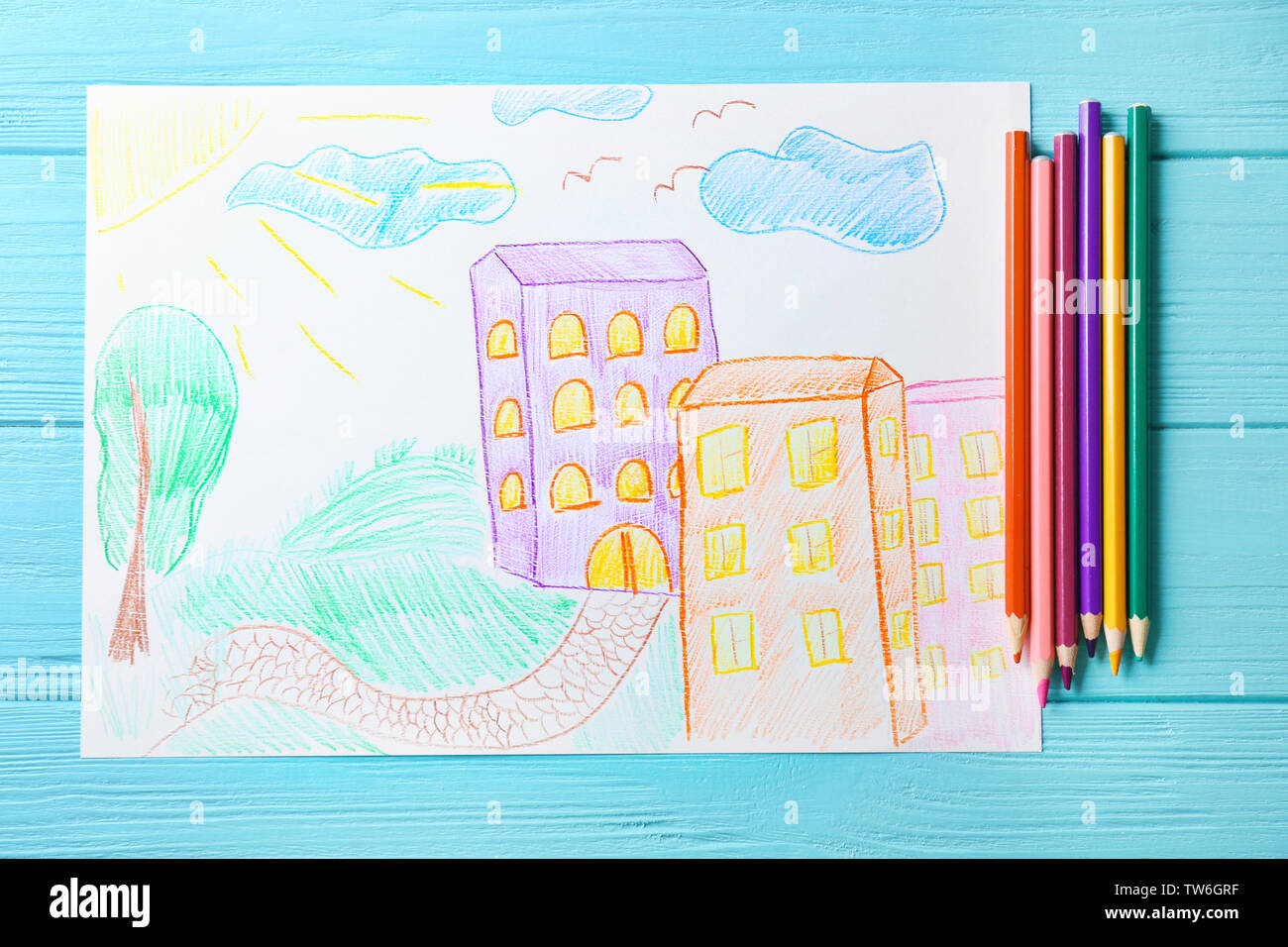 Child's drawing of buildings in city on blue background Stock Photo - Alamy