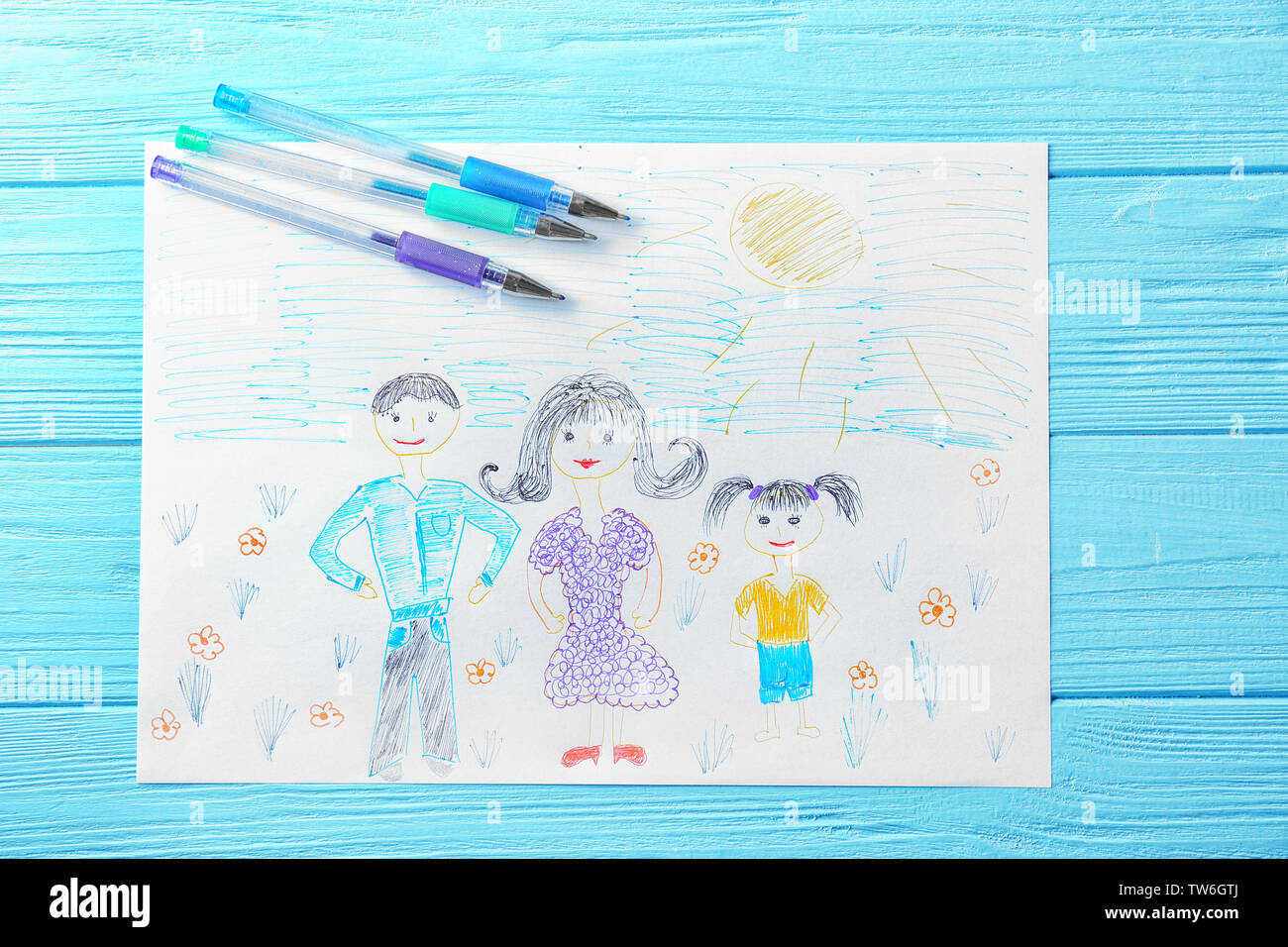 Child's drawing of family on blue background Stock Photo - Alamy