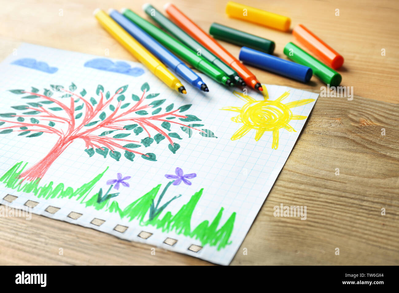 Child's drawing of tree on wooden table, closeup Stock Photo - Alamy