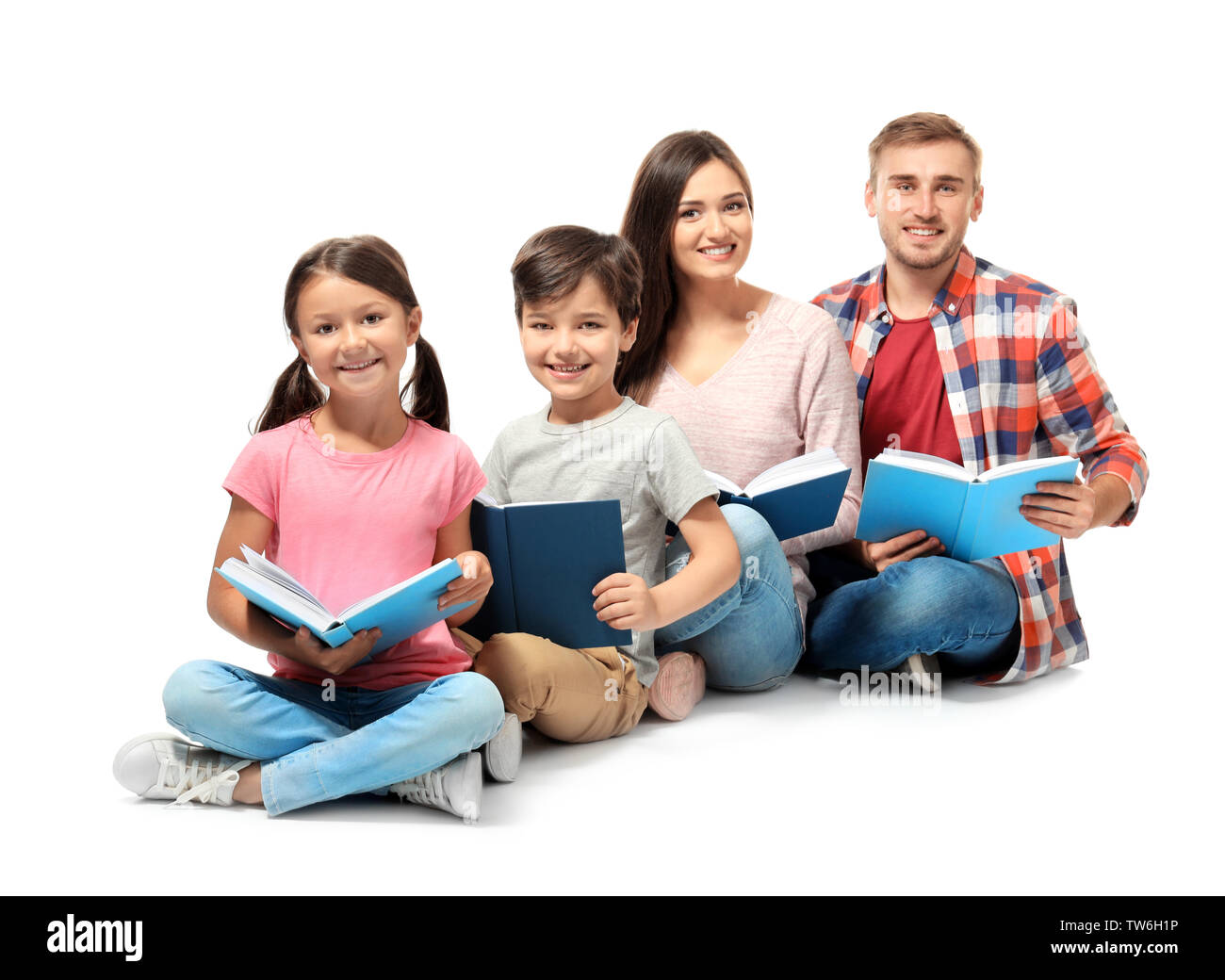 Happy family reading books on white background Stock Photo - Alamy
