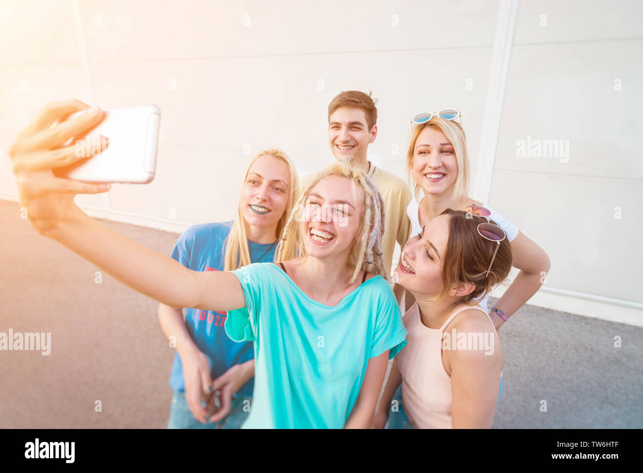 Young people taking a selfie photo with phone camera Stock Photo - Alamy