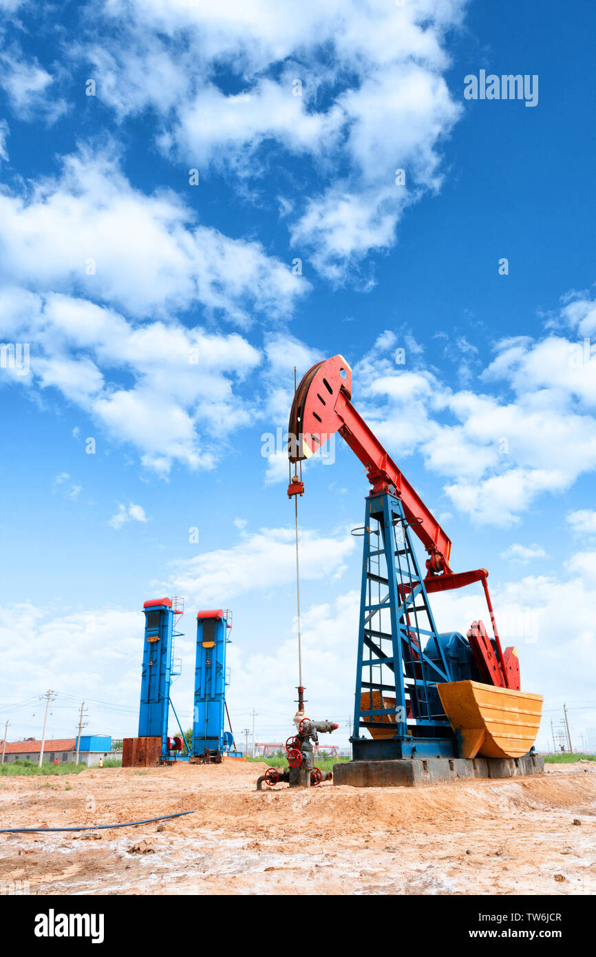 Oil well and bluesky Stock Photo - Alamy
