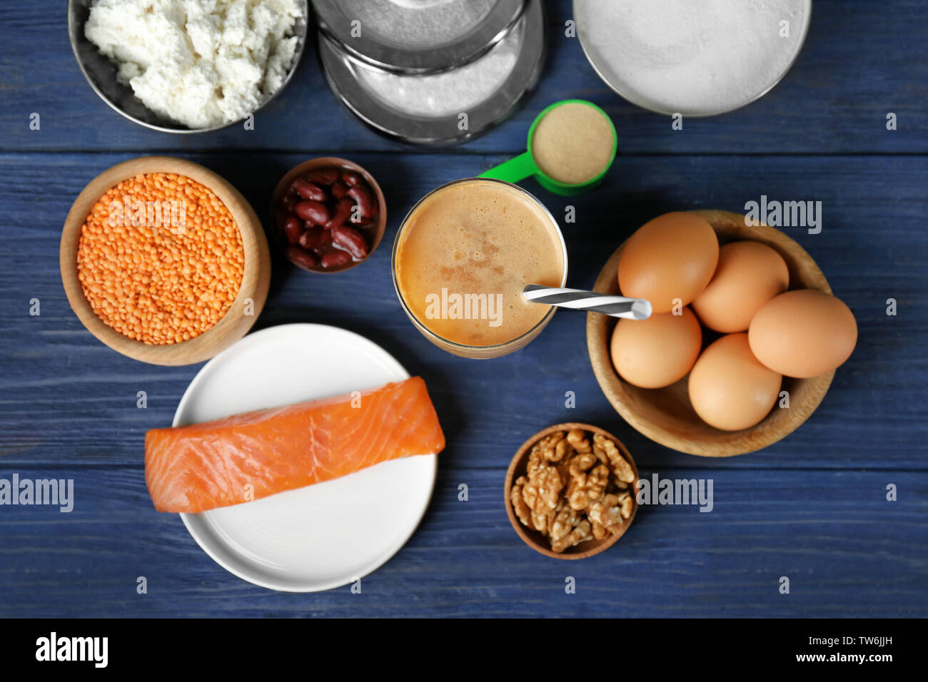 Composition with high protein food, powder and shake on wooden ...