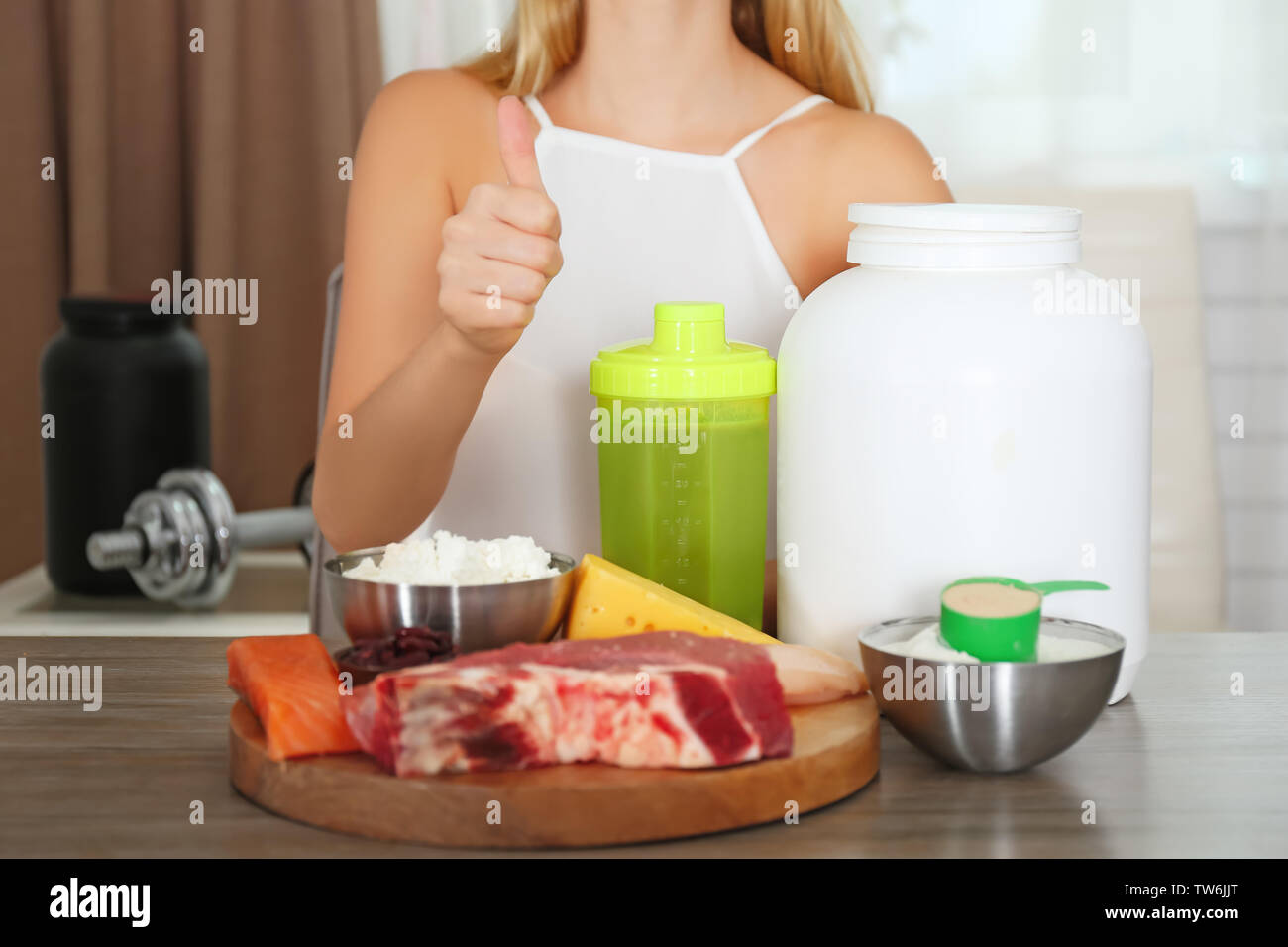 High protein food, powder, shake and woman at table Stock Photo - Alamy