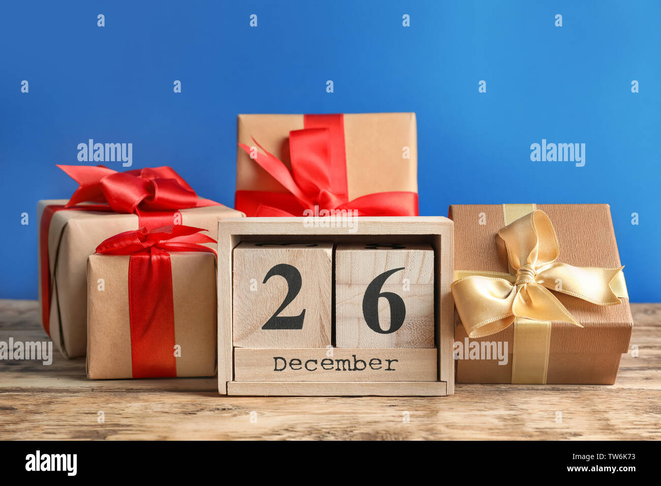Calendar with date and gift boxes on color background. Christmas ...