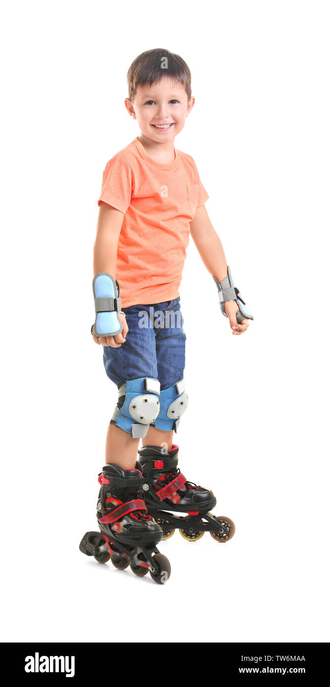 Boy on roller skates against white background Stock Photo - Alamy