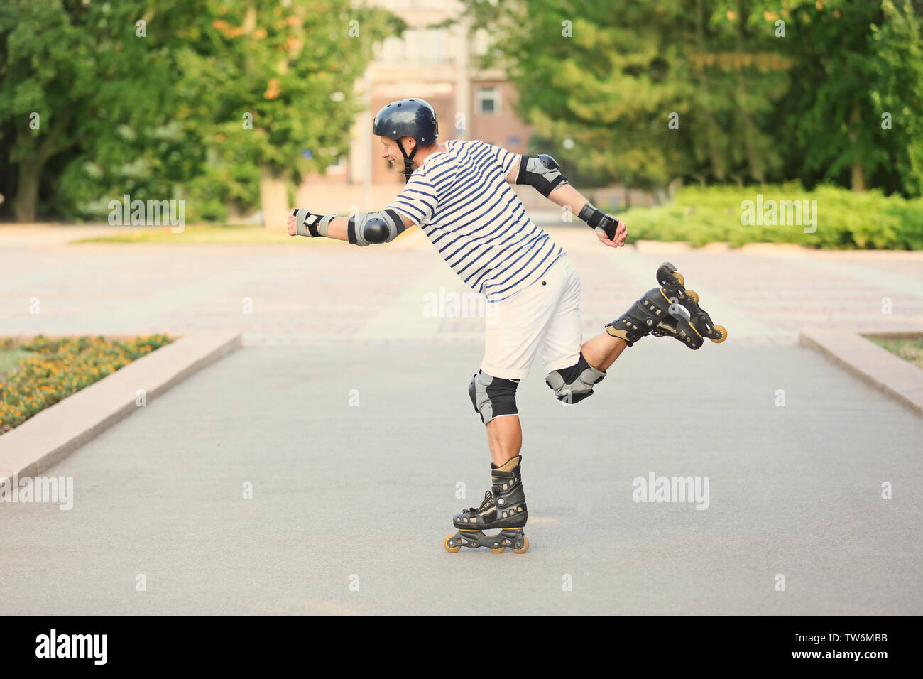 Man on roller skates hi-res stock photography and images - Alamy