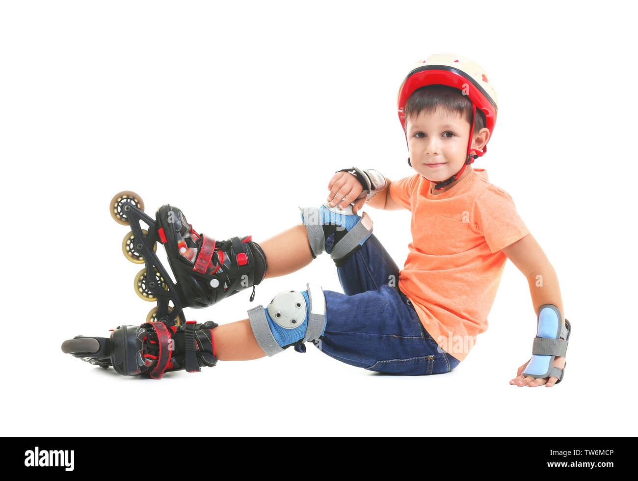 Boy on roller skates against white background Stock Photo - Alamy