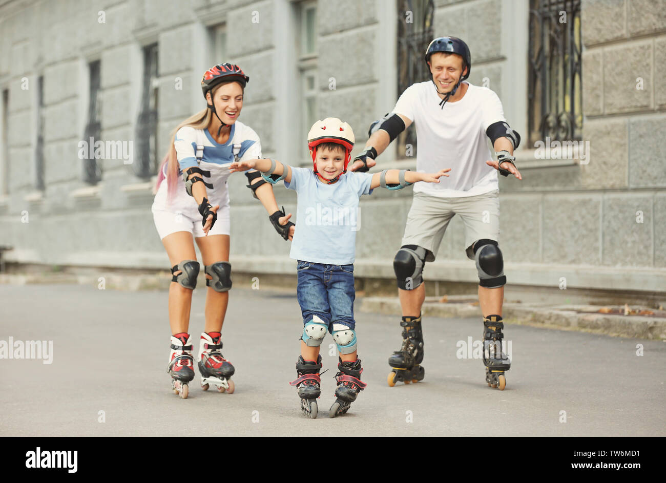 Family on roller skates outdoors Stock Photo - Alamy