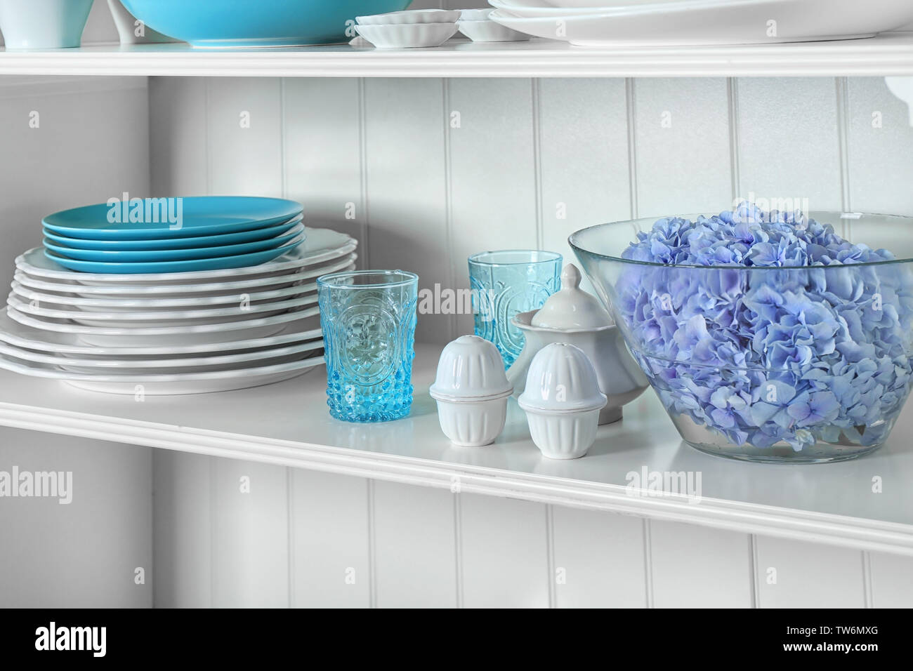 White storage stand with dishware in kitchen Stock Photo - Alamy