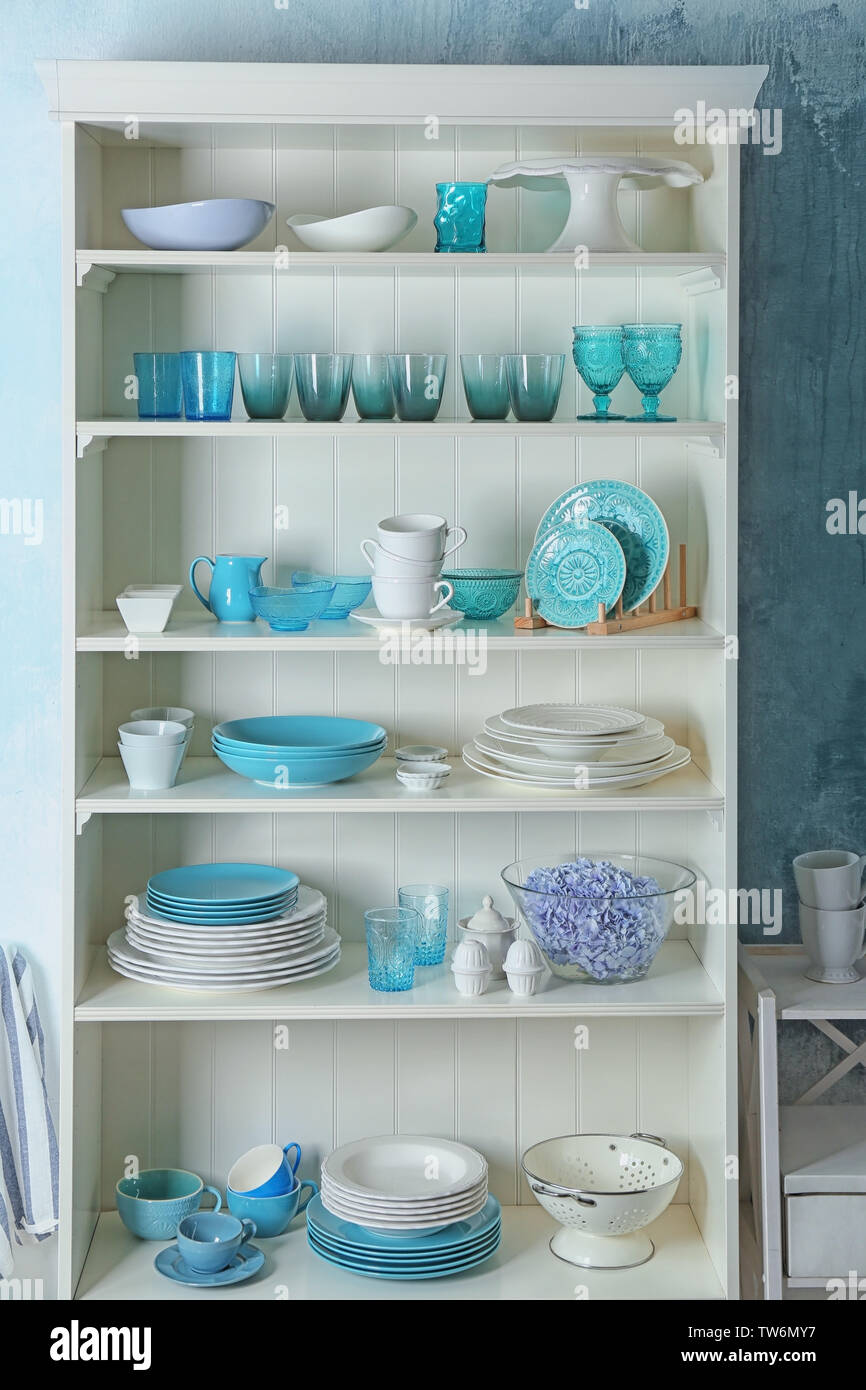 White storage stand with dishware in kitchen Stock Photo - Alamy