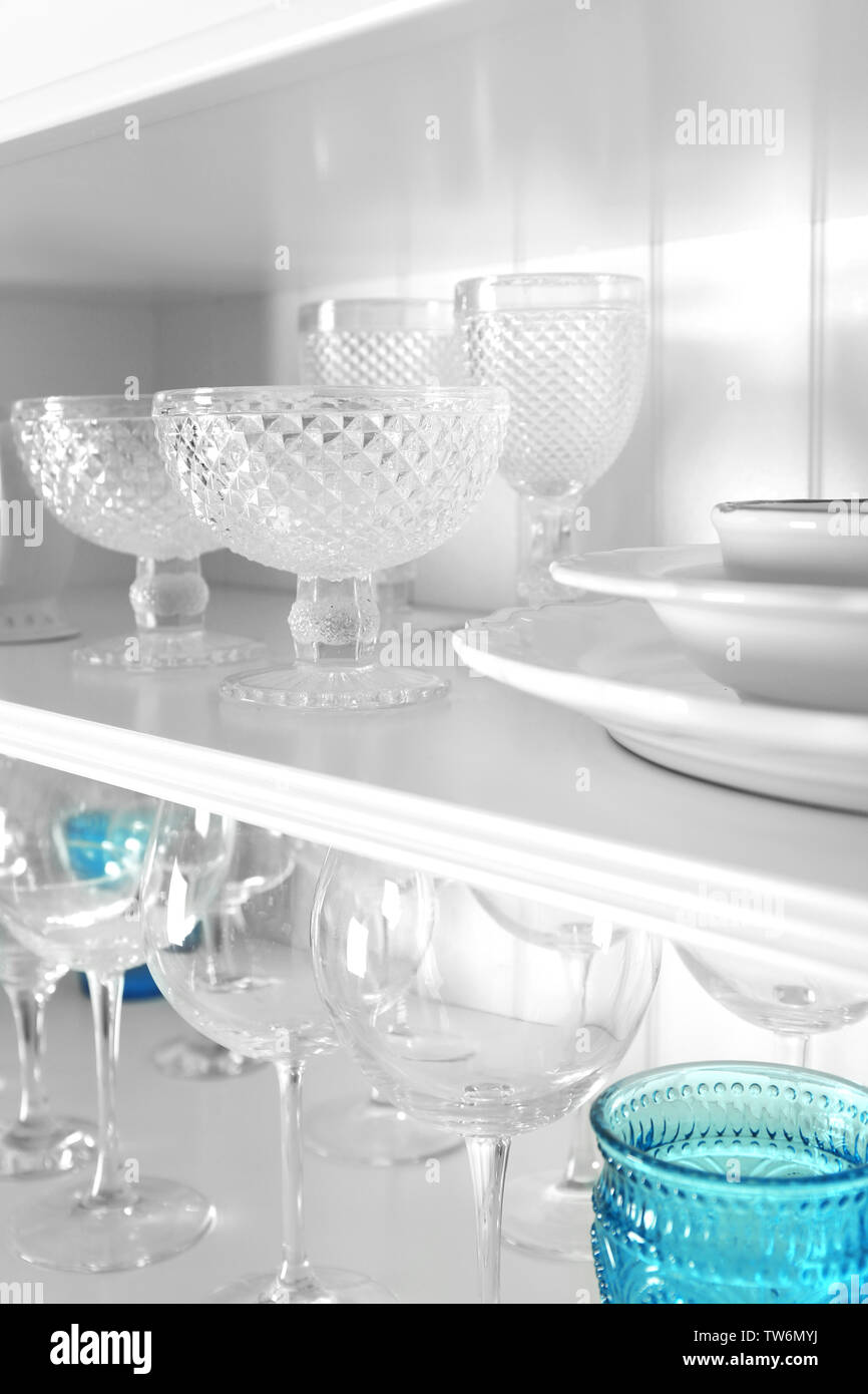 Storage stand with glassware in kitchen Stock Photo - Alamy