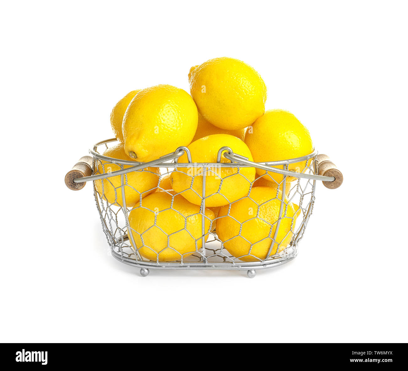Metal basket with ripe yellow lemons on white background Stock Photo ...