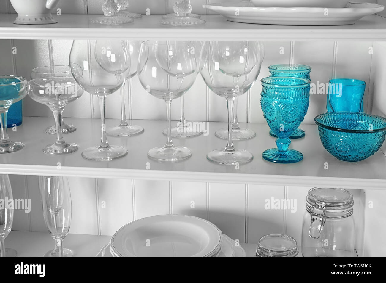 White storage stand with glassware in kitchen Stock Photo - Alamy