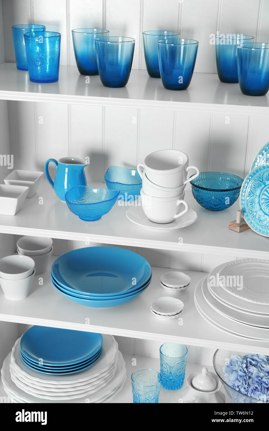 White storage stand with dishware in kitchen Stock Photo - Alamy
