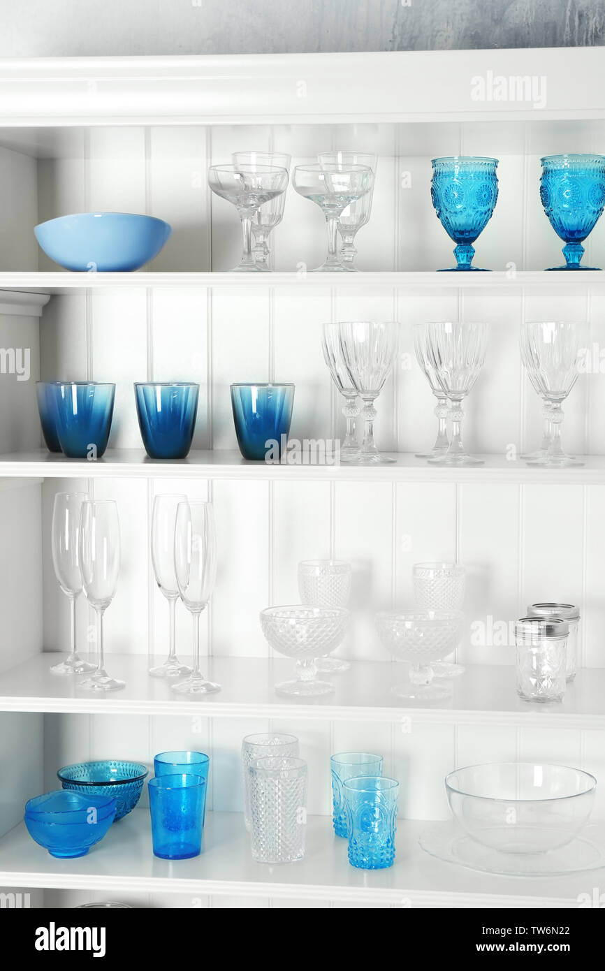 White storage stand with glassware in kitchen Stock Photo - Alamy