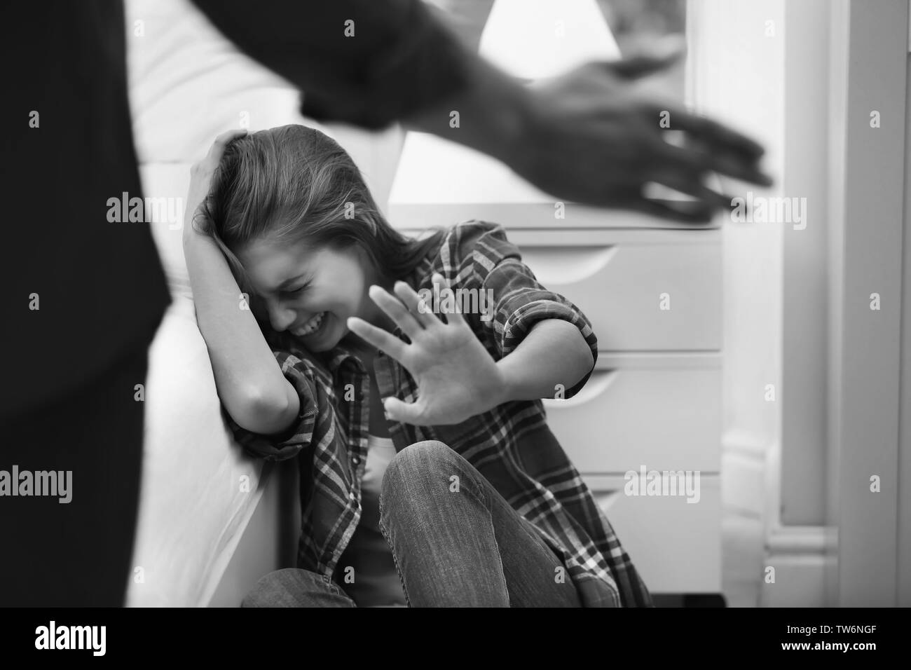 Man abusing young woman at home Stock Photo - Alamy