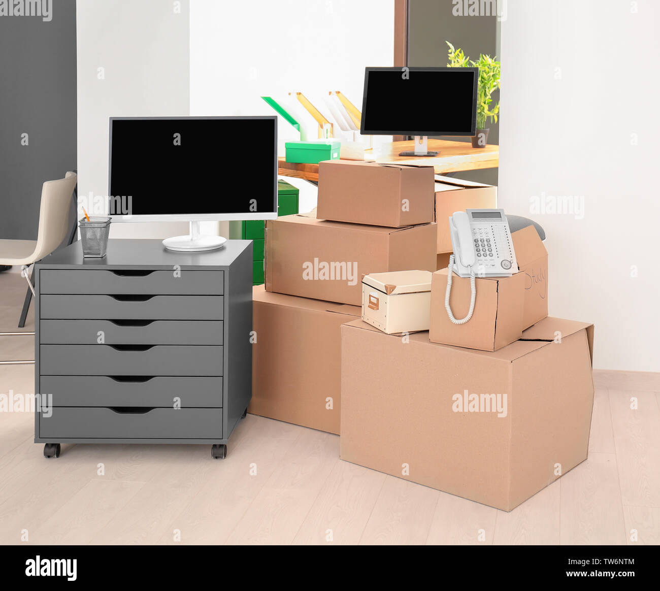 Moving boxes and different stuff in new office Stock Photo - Alamy