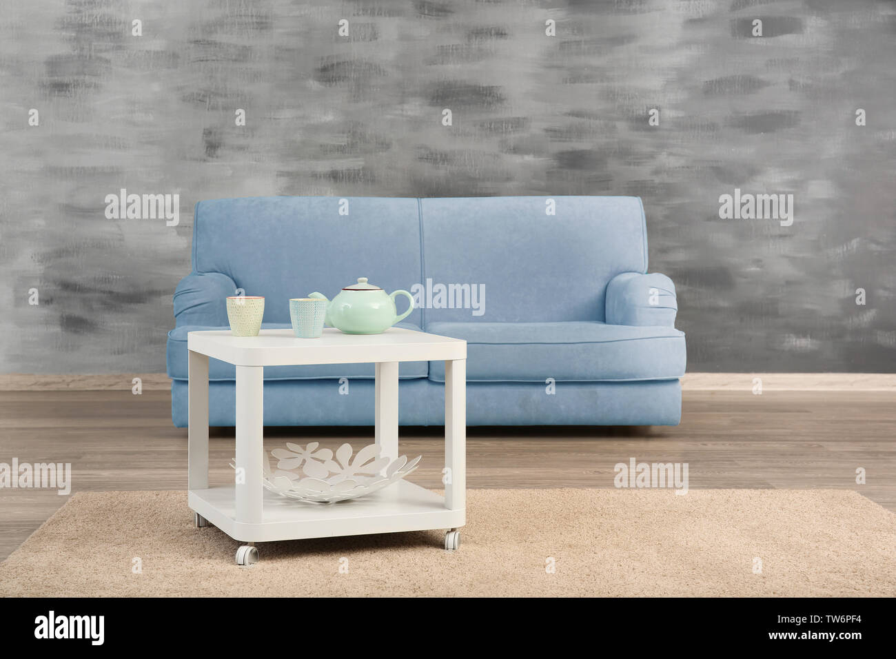 Modern living room with cozy sofa Stock Photo - Alamy