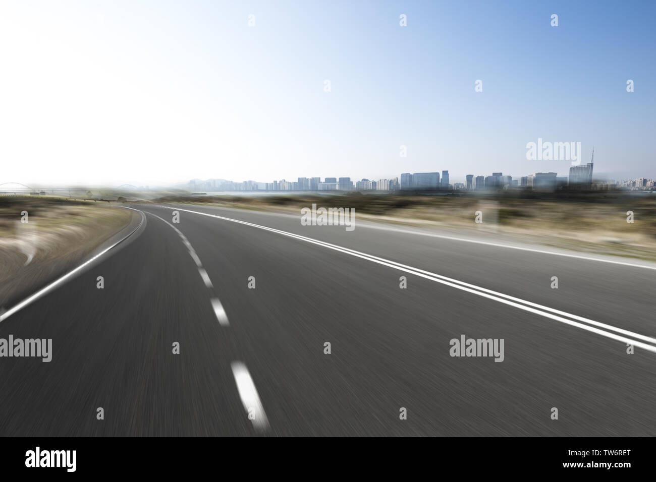emtpy asphalt road with cityscape of modern city Stock Photo - Alamy