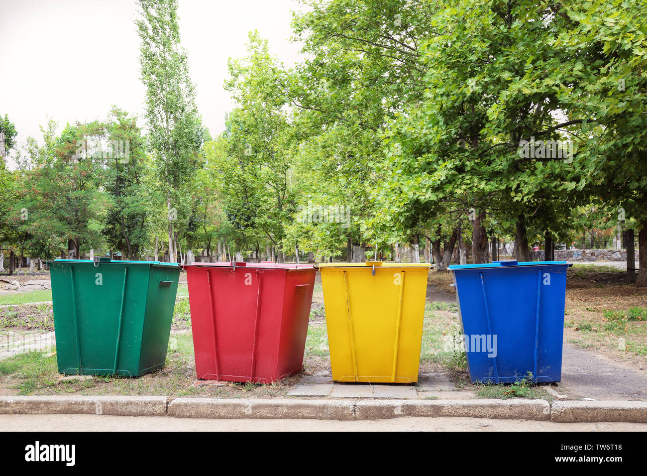 Recycling bins for different types of garbage outdoors Stock Photo - Alamy