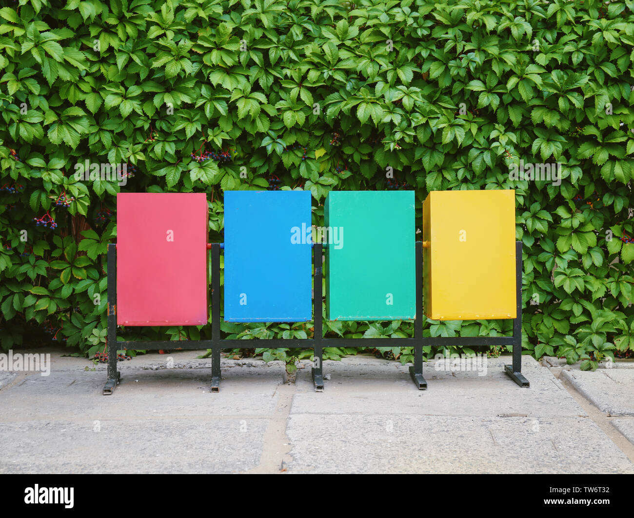 Recycling bins for different types of garbage outdoors Stock Photo - Alamy