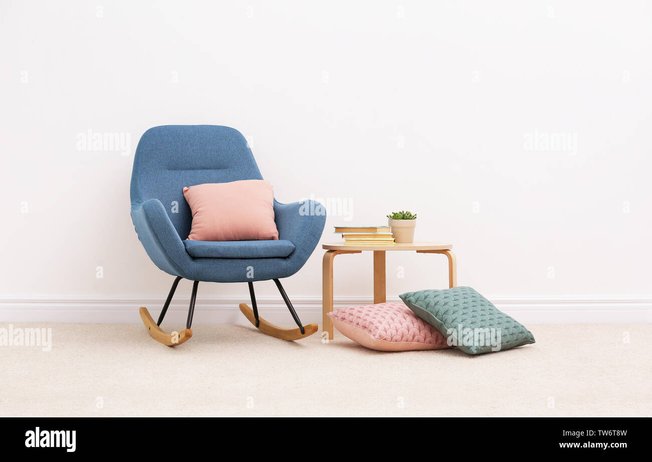 Interior of beautiful room with rocking chair and light carpet Stock ...