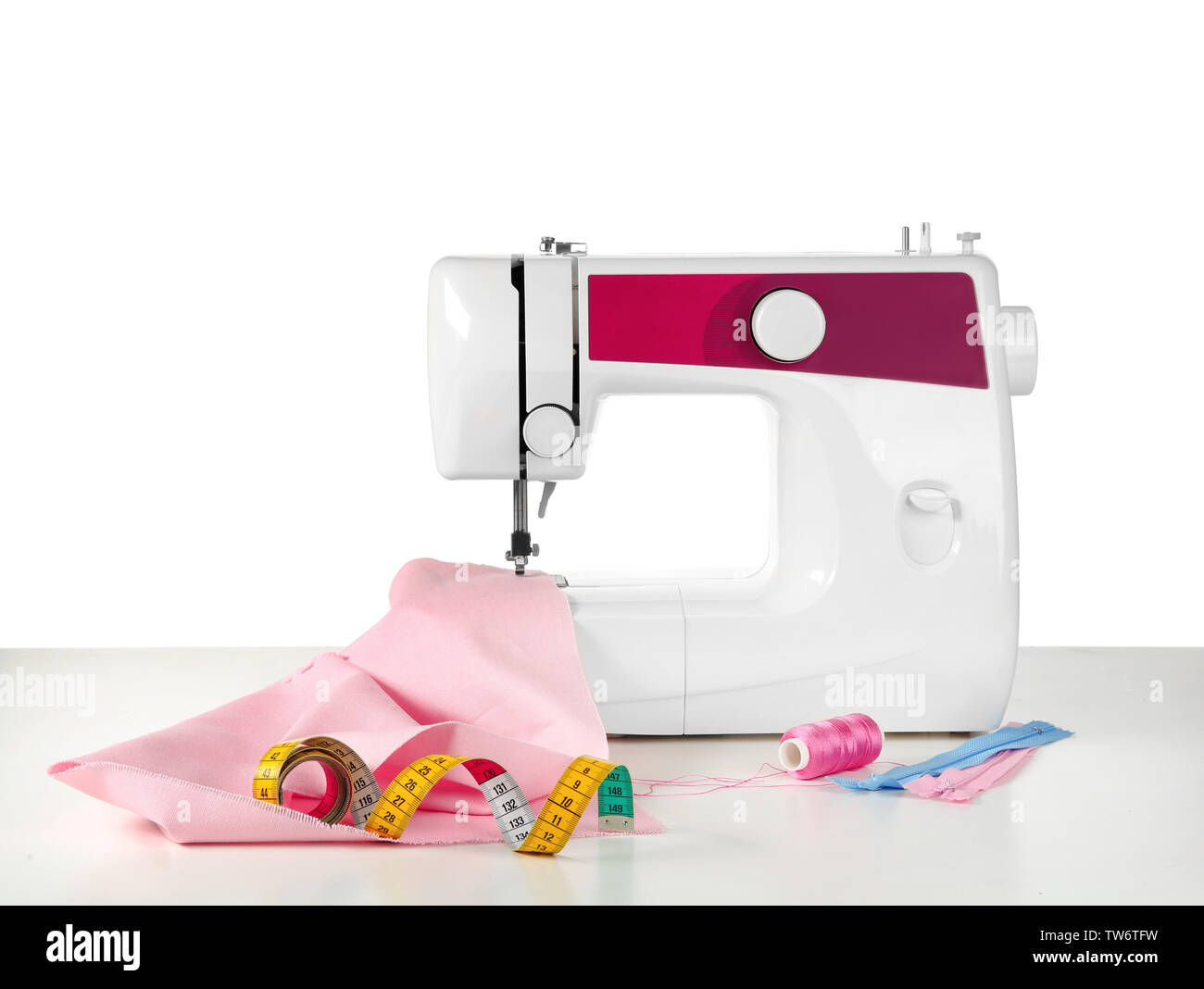 Sewing machine on white background Stock Photo - Alamy