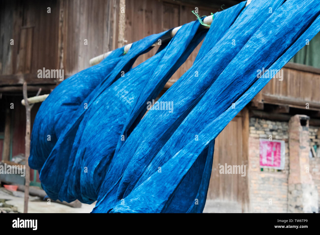 Drying indigo dyed cloth in the village, Huanggang, Zhaoxing, Guizhou ...