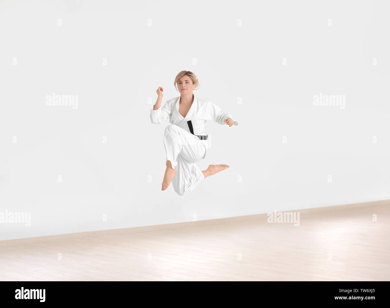 Female karate instructor training in dojo Stock Photo - Alamy