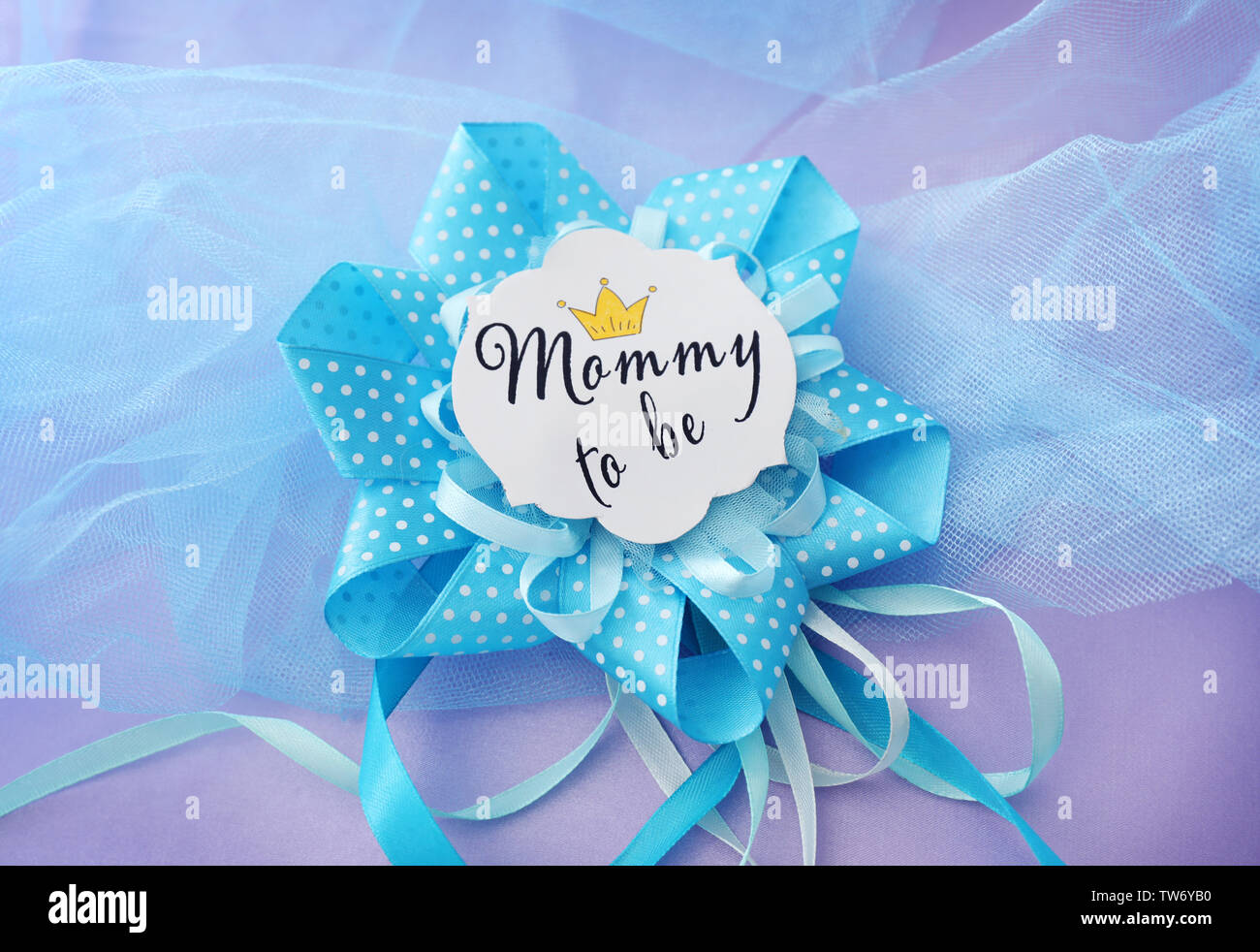 Award ribbon for baby shower party and tulle on color background Stock ...