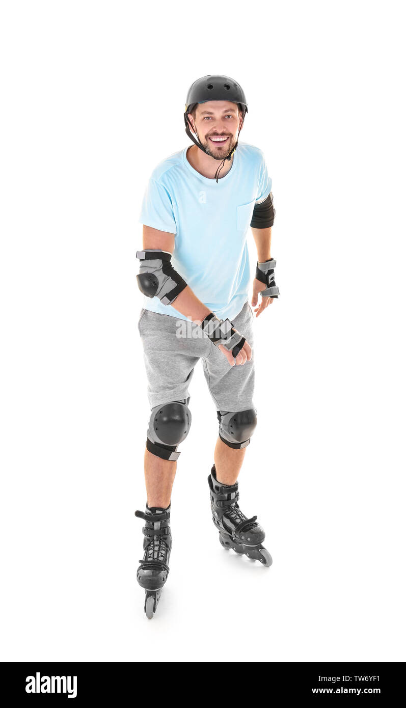 Handsome man on roller skates against white background Stock Photo - Alamy