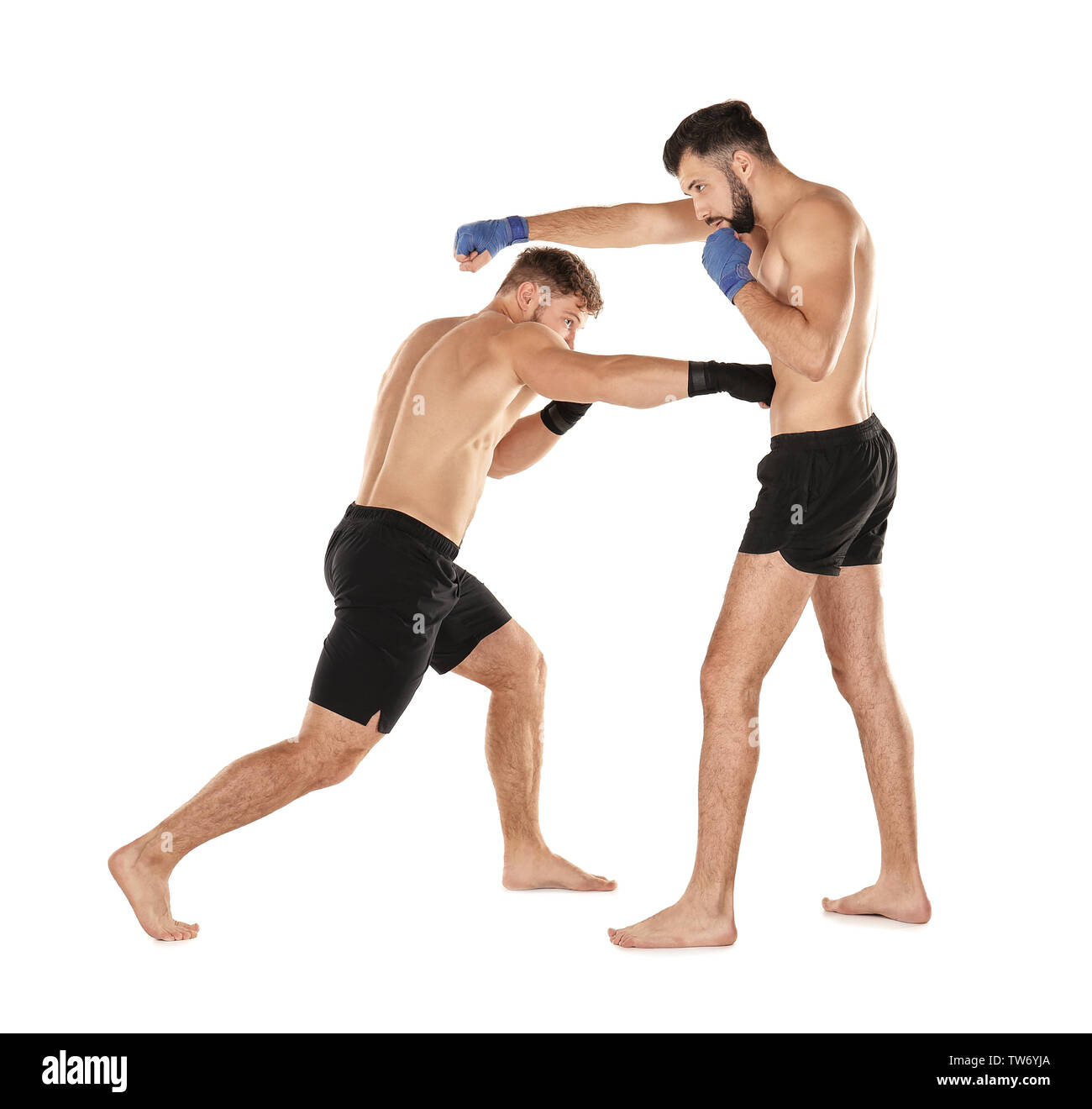 Male boxers fighting on white background Stock Photo - Alamy