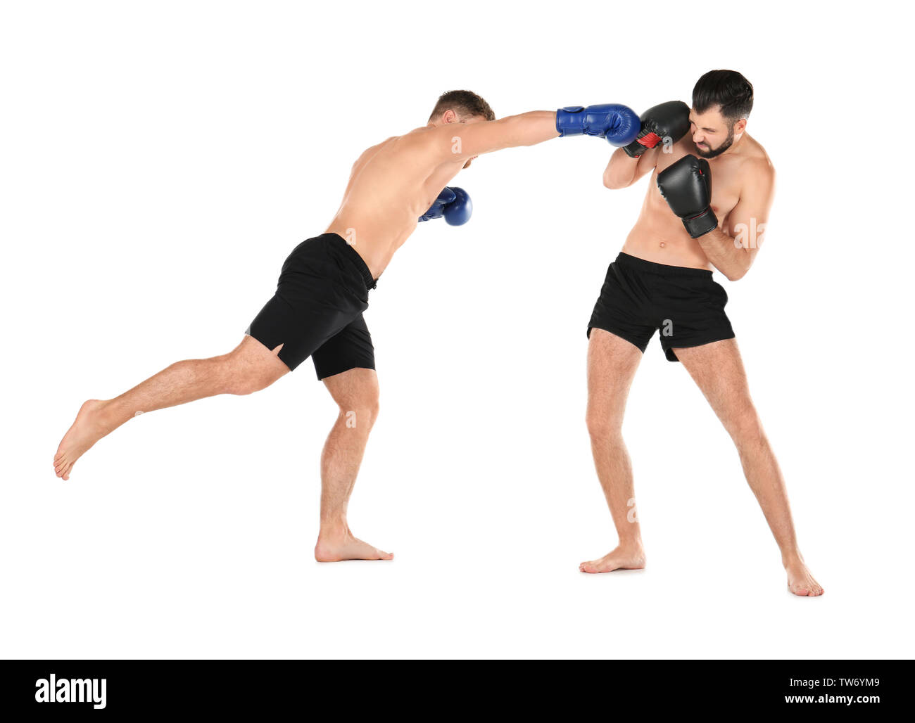 Male kickboxers fighting on white background Stock Photo - Alamy