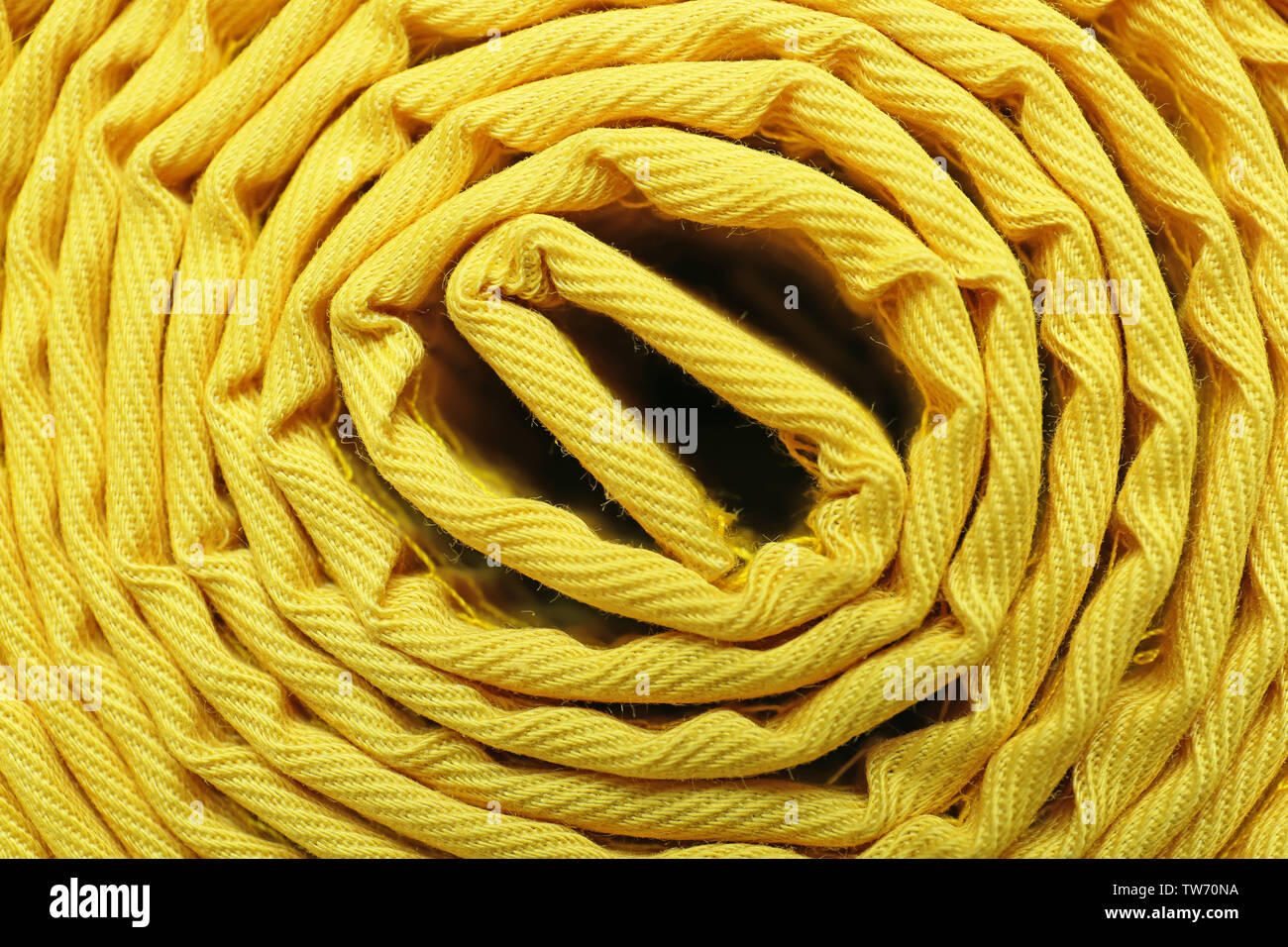 Rolled yellow karate belt, closeup Stock Photo - Alamy